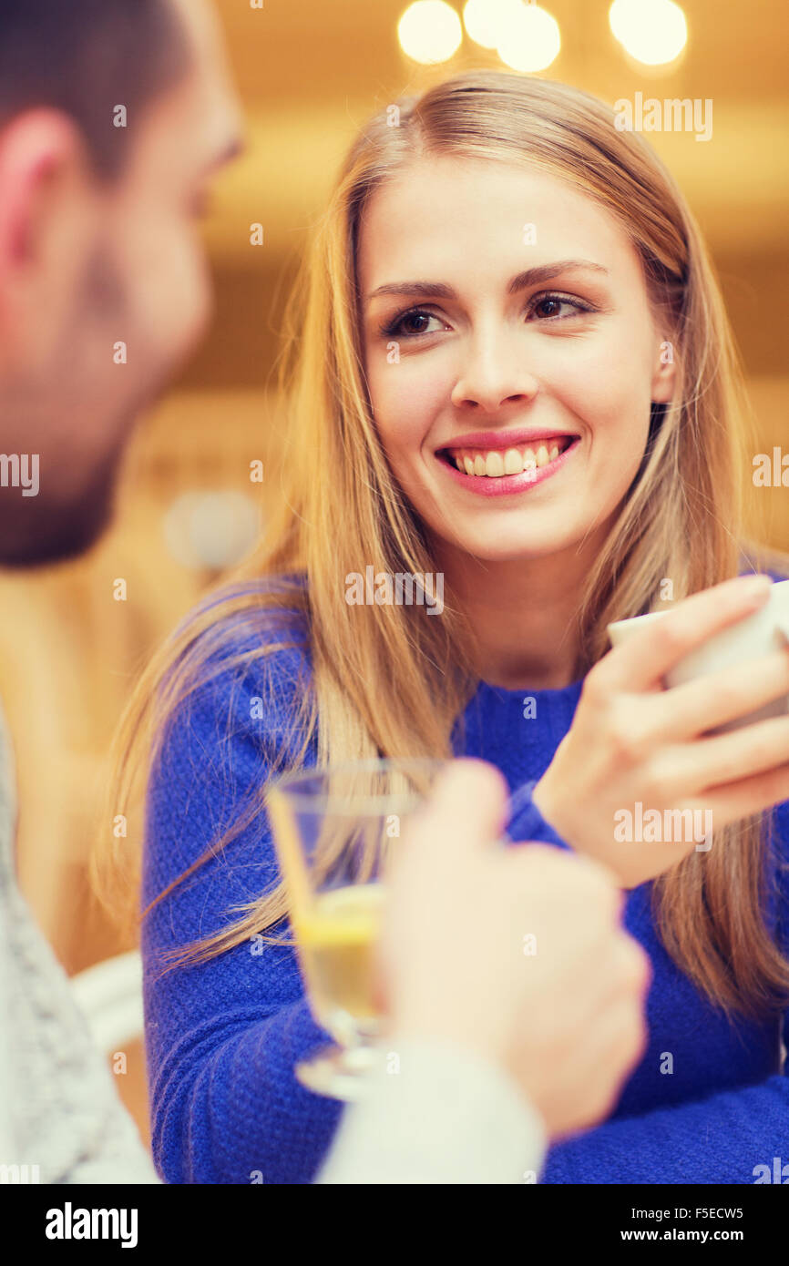 happy couple dating and drinking tea at cafe Stock Photo - Alamy