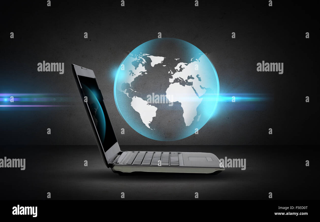 open laptop computer with globe projection Stock Photo - Alamy