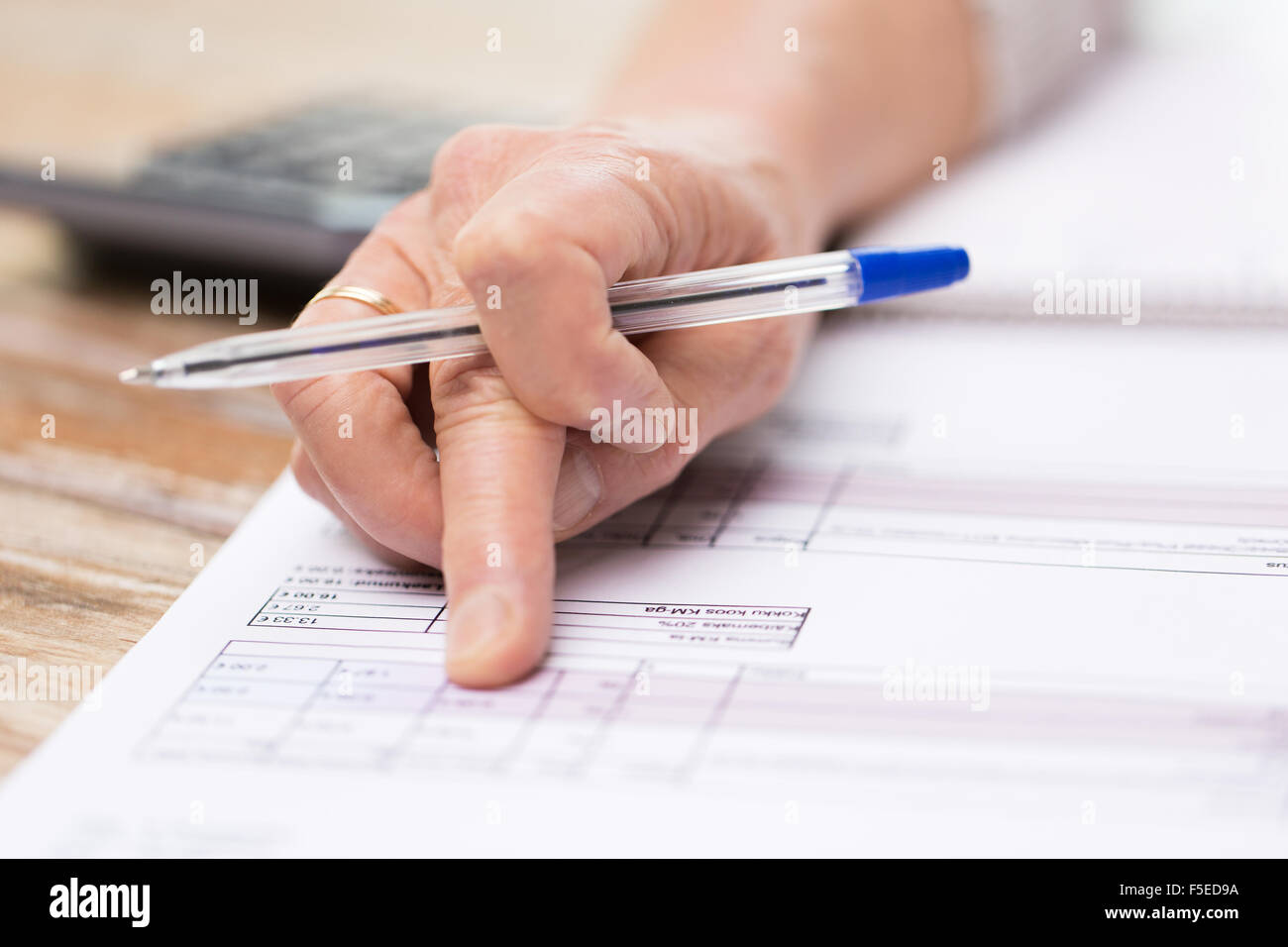 close up of senior woman hand checking bill Stock Photo - Alamy