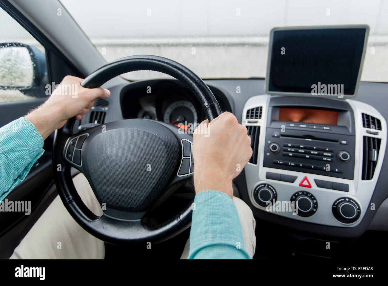 close up of young man with tablet pc driving car Stock Photo - Alamy