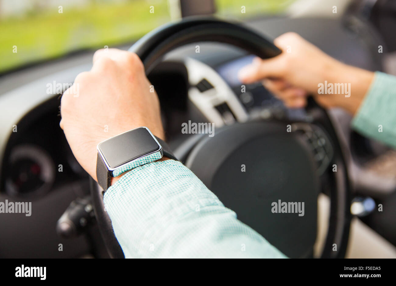 close up of man with wristwatch driving car Stock Photo - Alamy