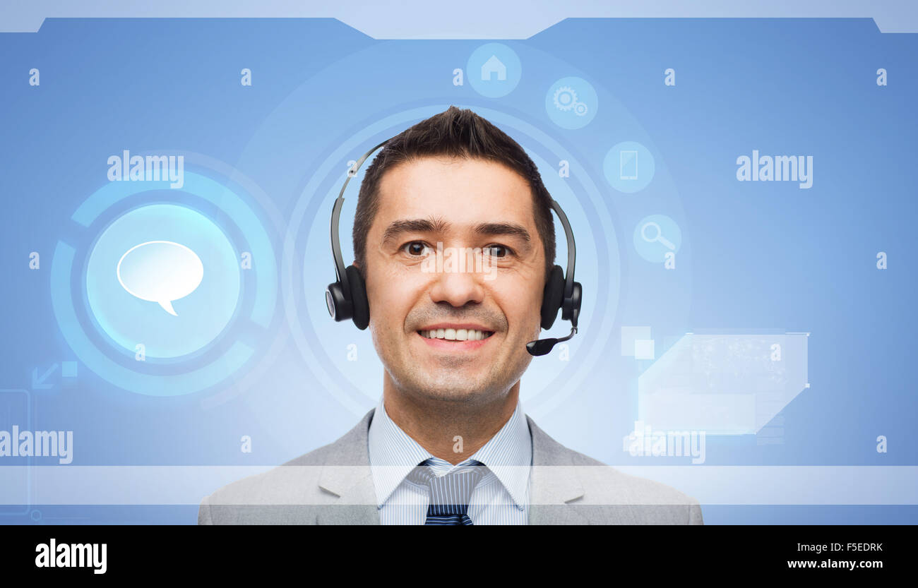 smiling businessman in headset over virtual screen Stock Photo - Alamy