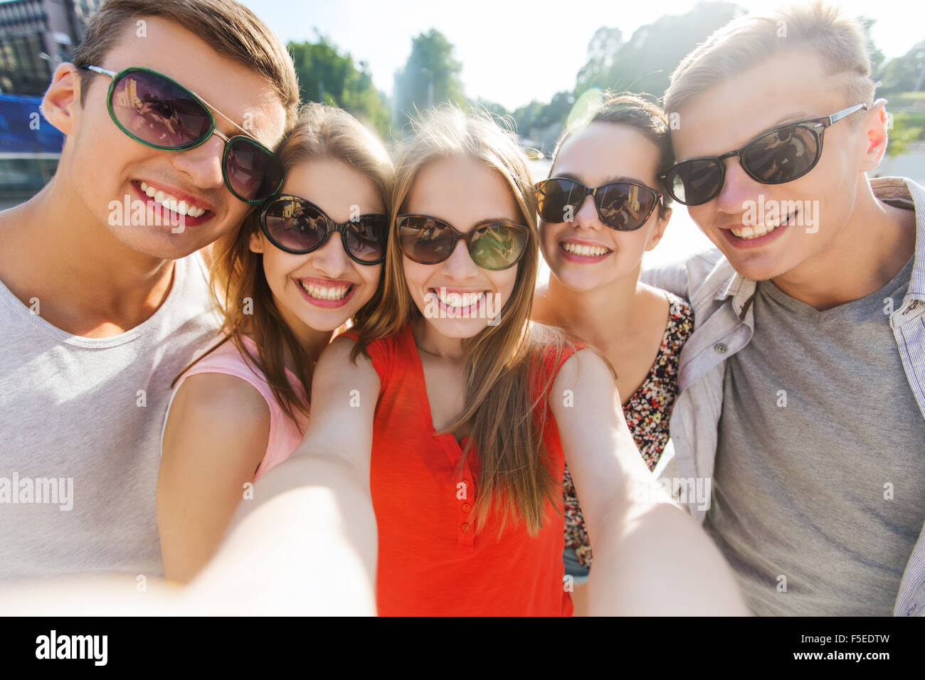smiling friends taking selfie Stock Photo - Alamy