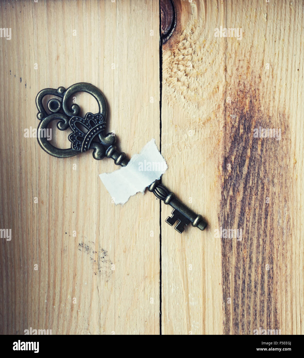 vintage key attached to wooden door Stock Photo - Alamy