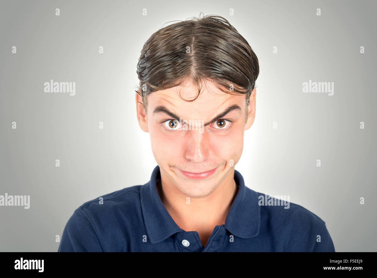 Angry geek teenage boy isolated in white Stock Photo - Alamy