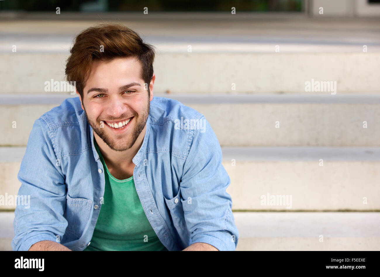 Close up portrait of a friendly young man smiling Stock Photo - Alamy