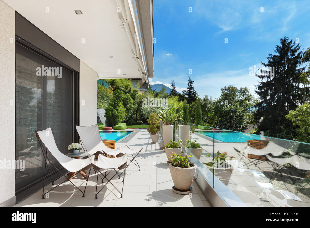 Modern house, beautiful terrace with swimming pool Stock Photo - Alamy