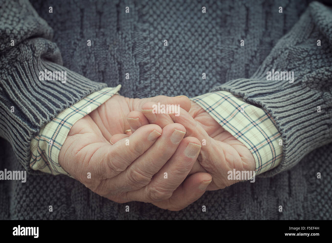 Rear view of a man holding hands behind his back Stock Photo - Alamy