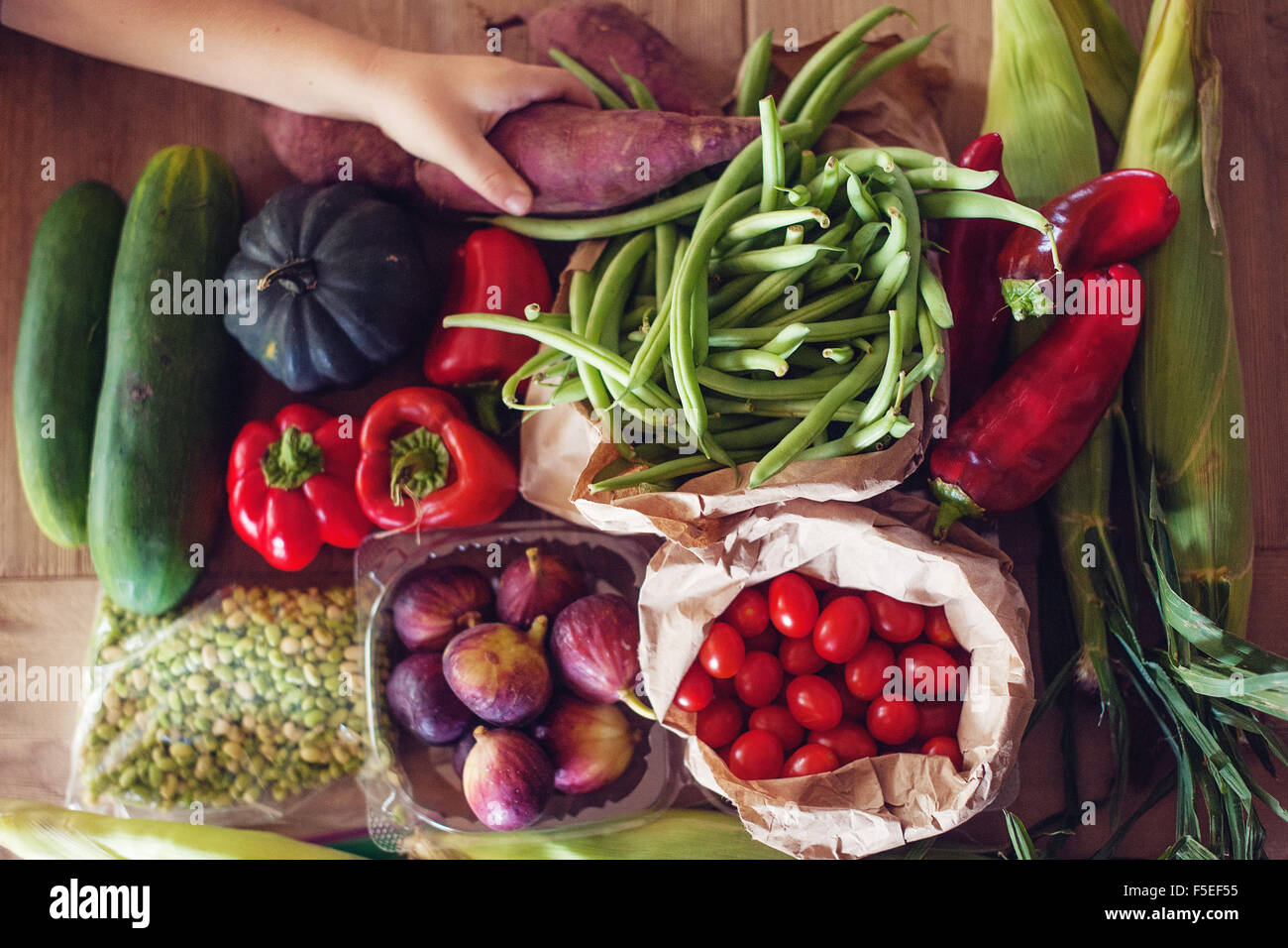 Close-up of hand reaching for fresh vegetables Stock Photo - Alamy