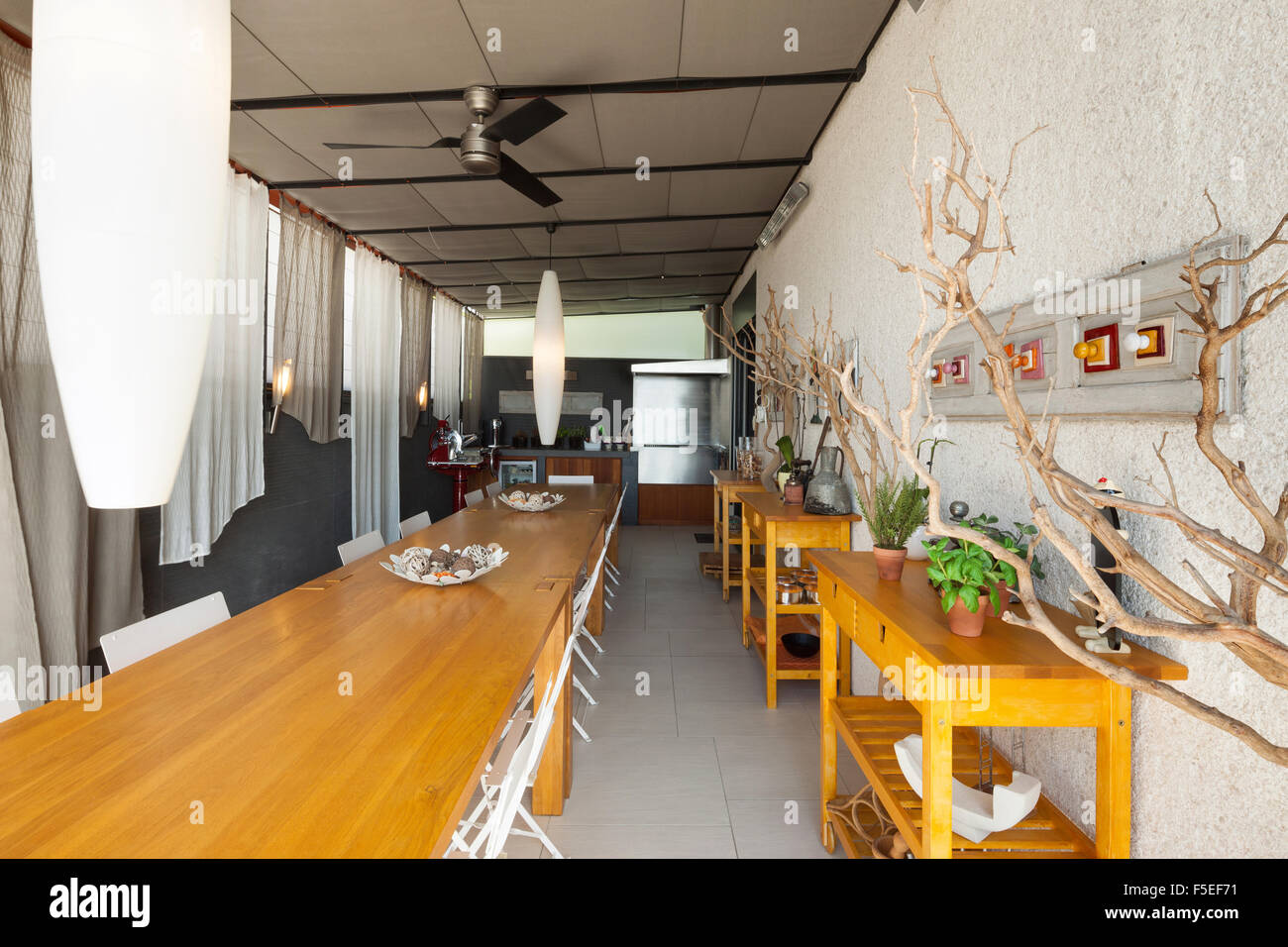 Interior of house, domestic kitchen with long wooden dining table Stock ...