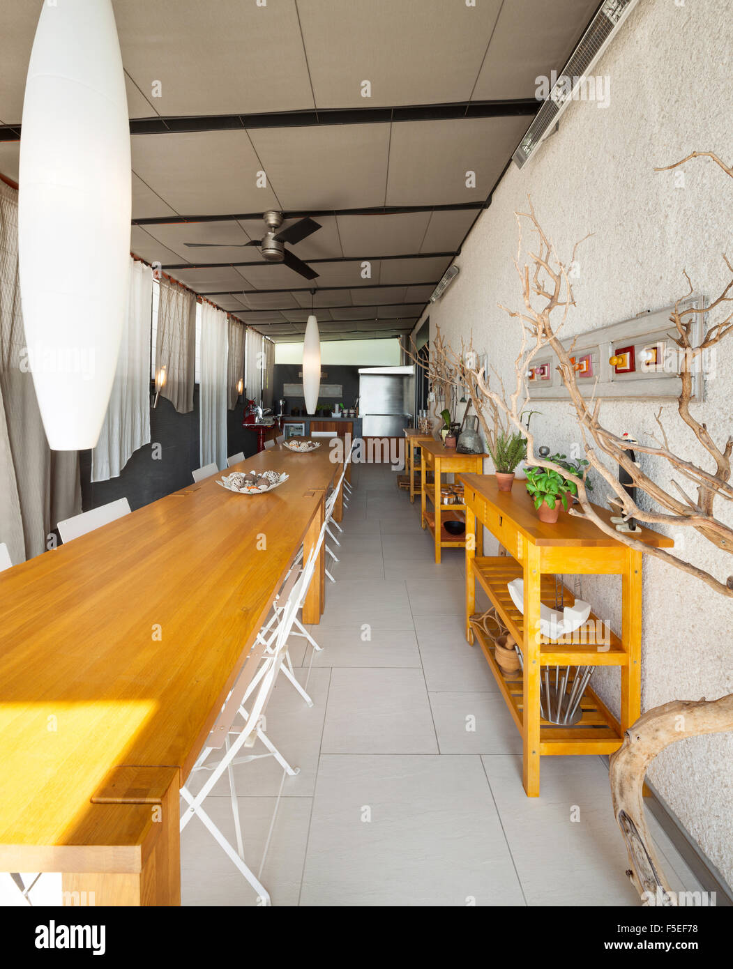 Interior of house, domestic kitchen with long wooden dining table Stock ...
