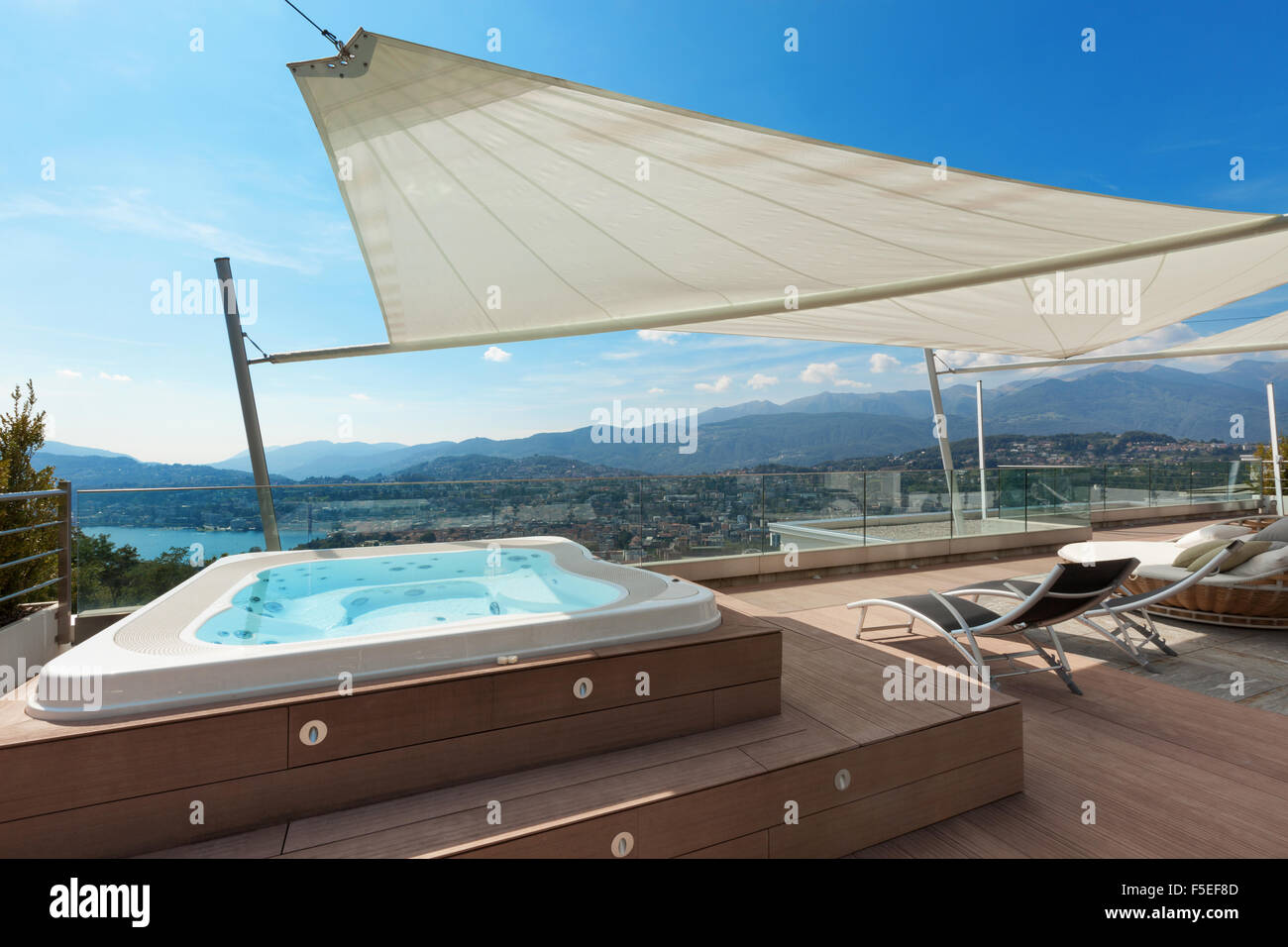 beautiful terrace of penthouse with jacuzzi Stock Photo - Alamy