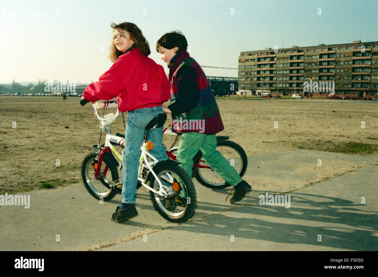 Two children riding bicycles hi-res stock photography and images - Alamy