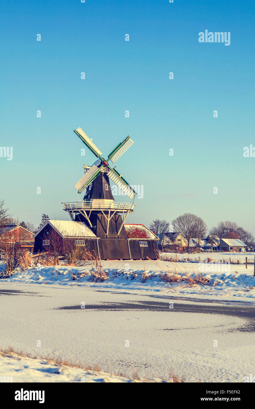 Antique wood and grain mill from 1903 in The Netherlands in the snow ...