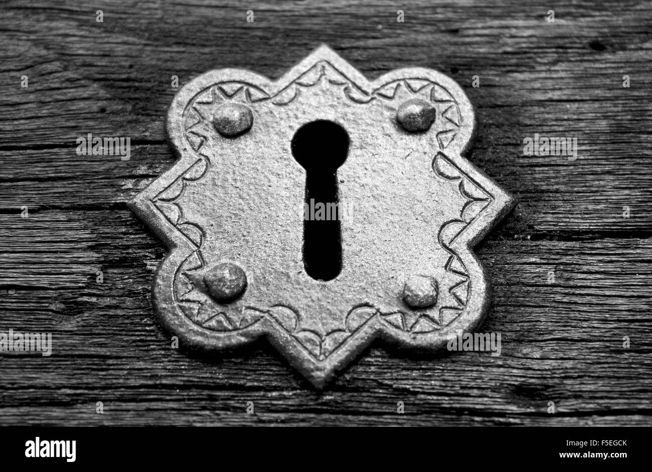 Old Metal Gothic Keyhole on wood in black and white Stock Photo - Alamy