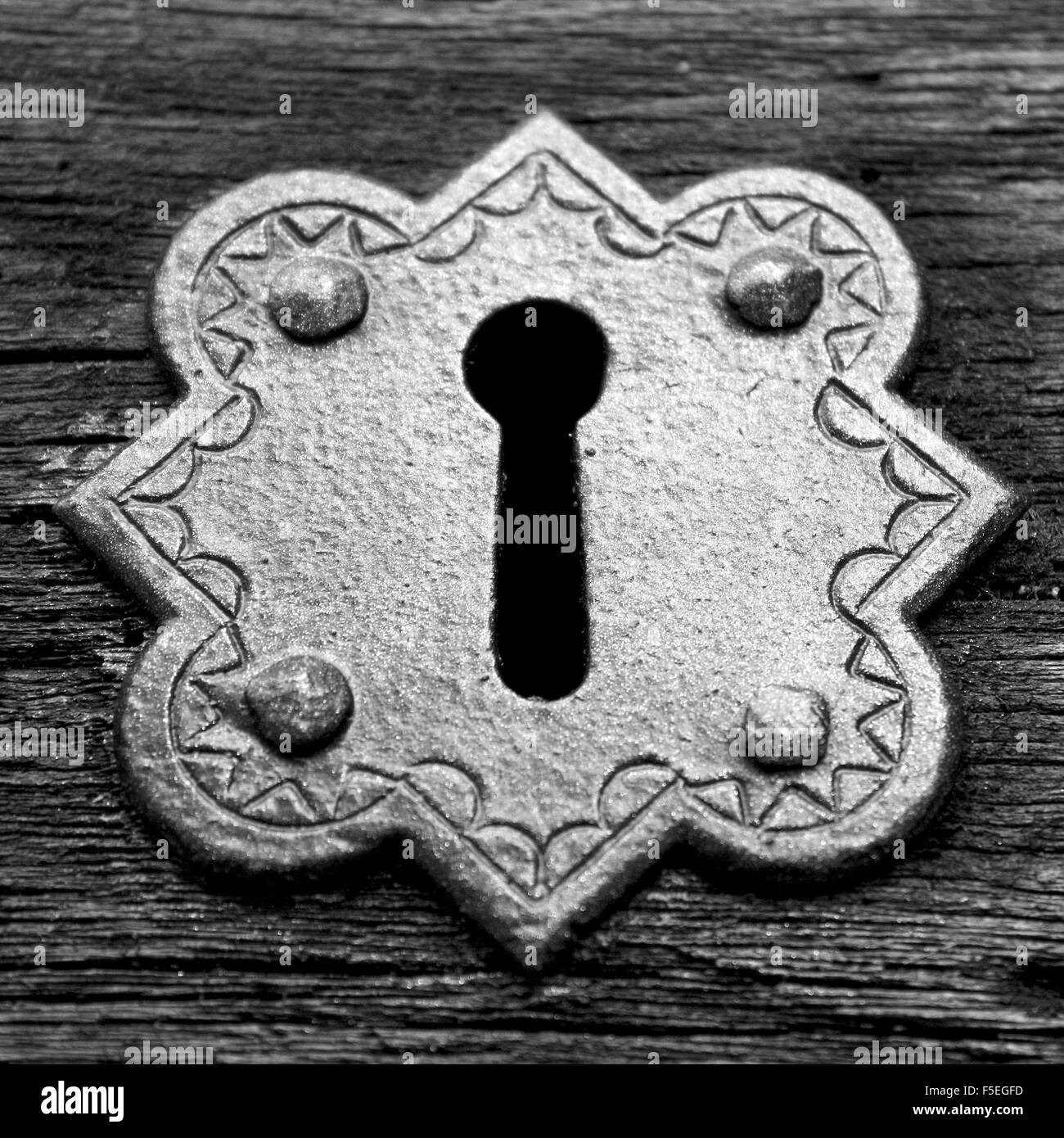 Old Metal Gothic Keyhole on wood in black and white Stock Photo - Alamy