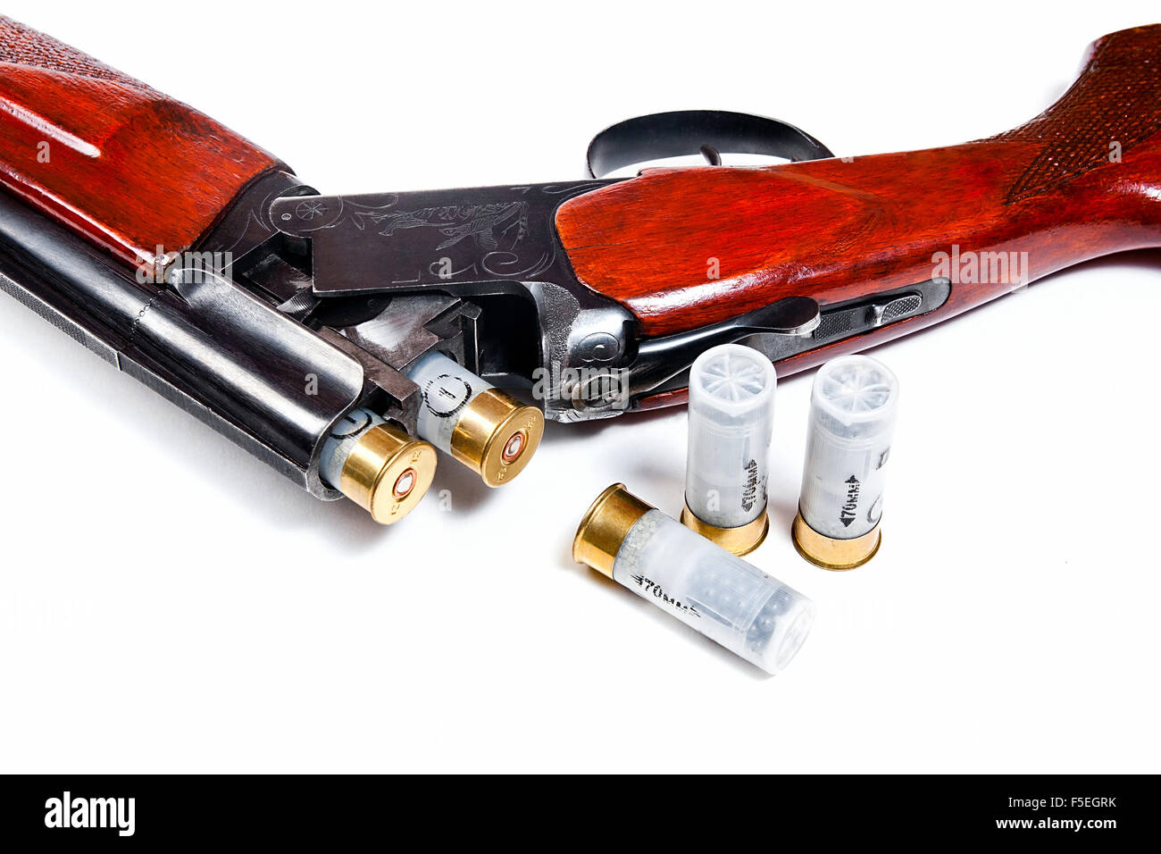 Hunting shotgun and ammunition on white background. Cartridges for ...