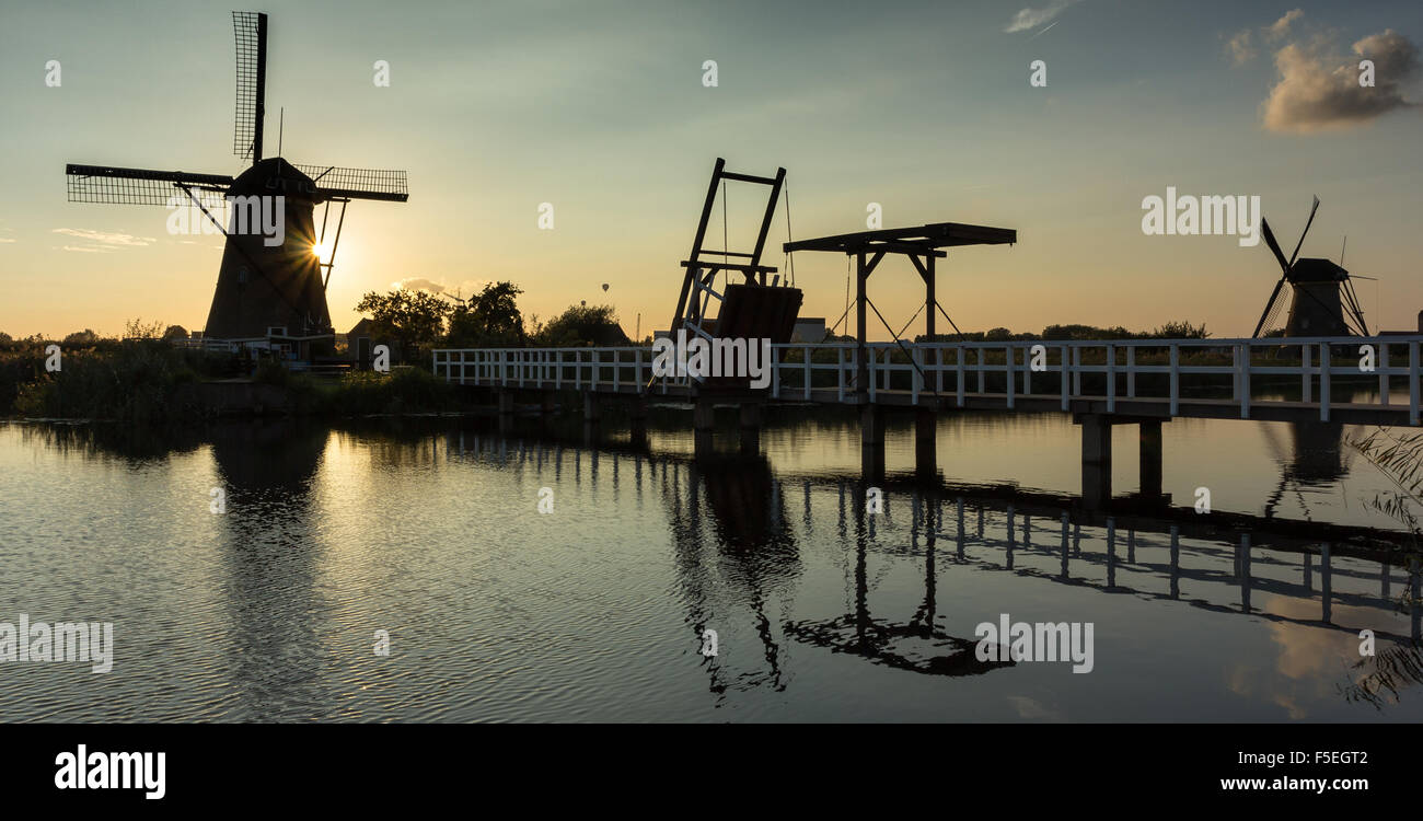 Traditional windmills at sunset, Kinderdisk, Netherlands Stock Photo ...