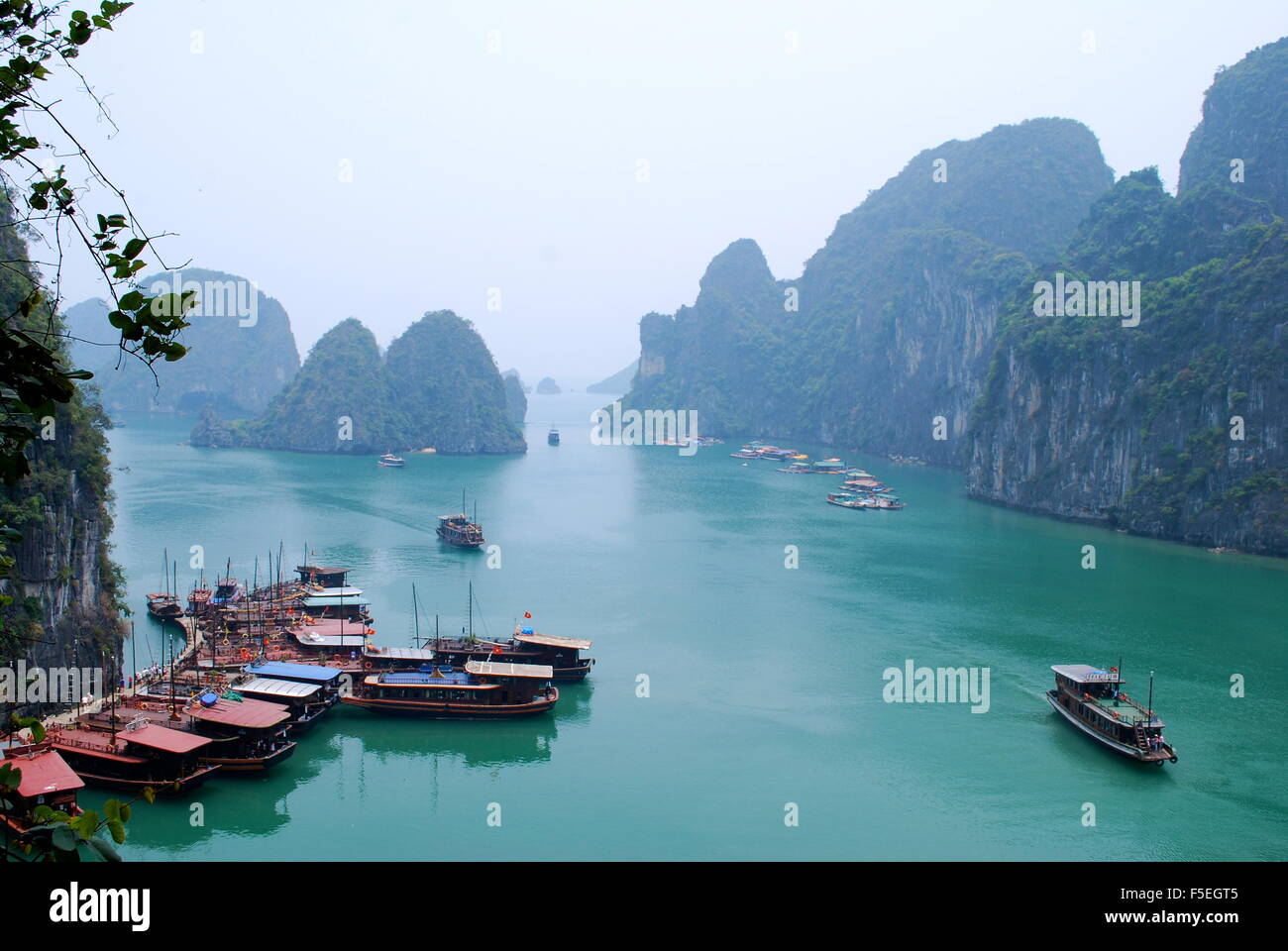 Tourist junks floating among limestone rocks at Ha Long Bay, South ...