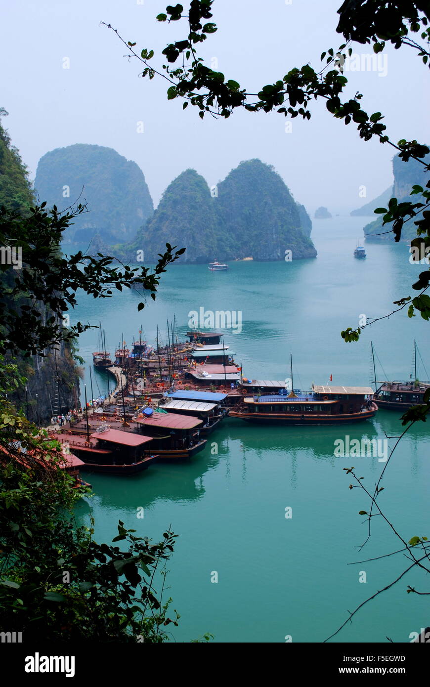 Tourist junks floating among limestone rocks at Ha Long Bay, South ...