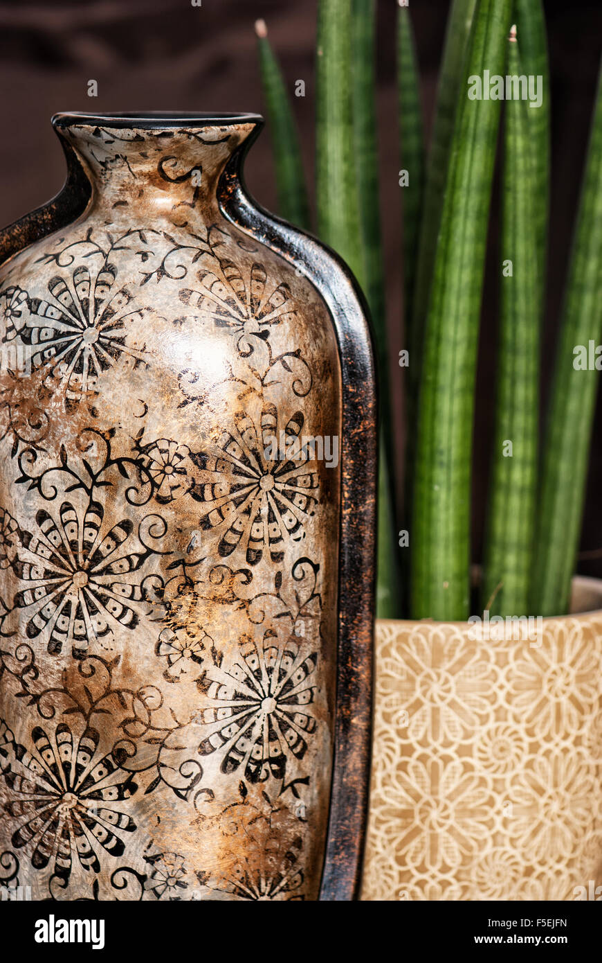 Ceramic vase with artistic pattern and potted plant. Beauty decorations ...