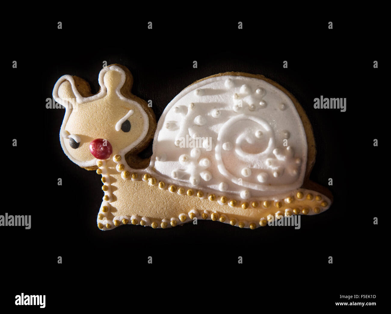 Tasty gingerbread slug on the dark background. Christmas theme. Bakery ...