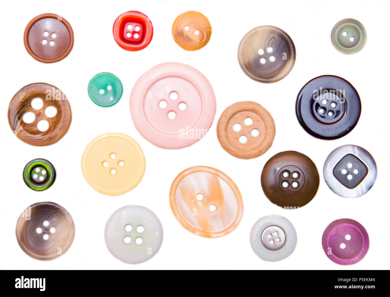 Colored buttons on a white background seen from above Stock Photo - Alamy