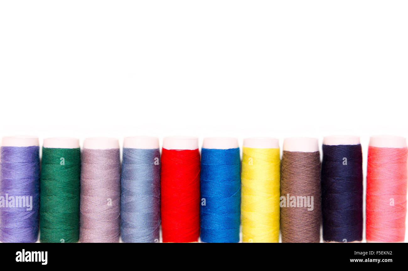 Row of sewing thread in different colors on white background Stock ...
