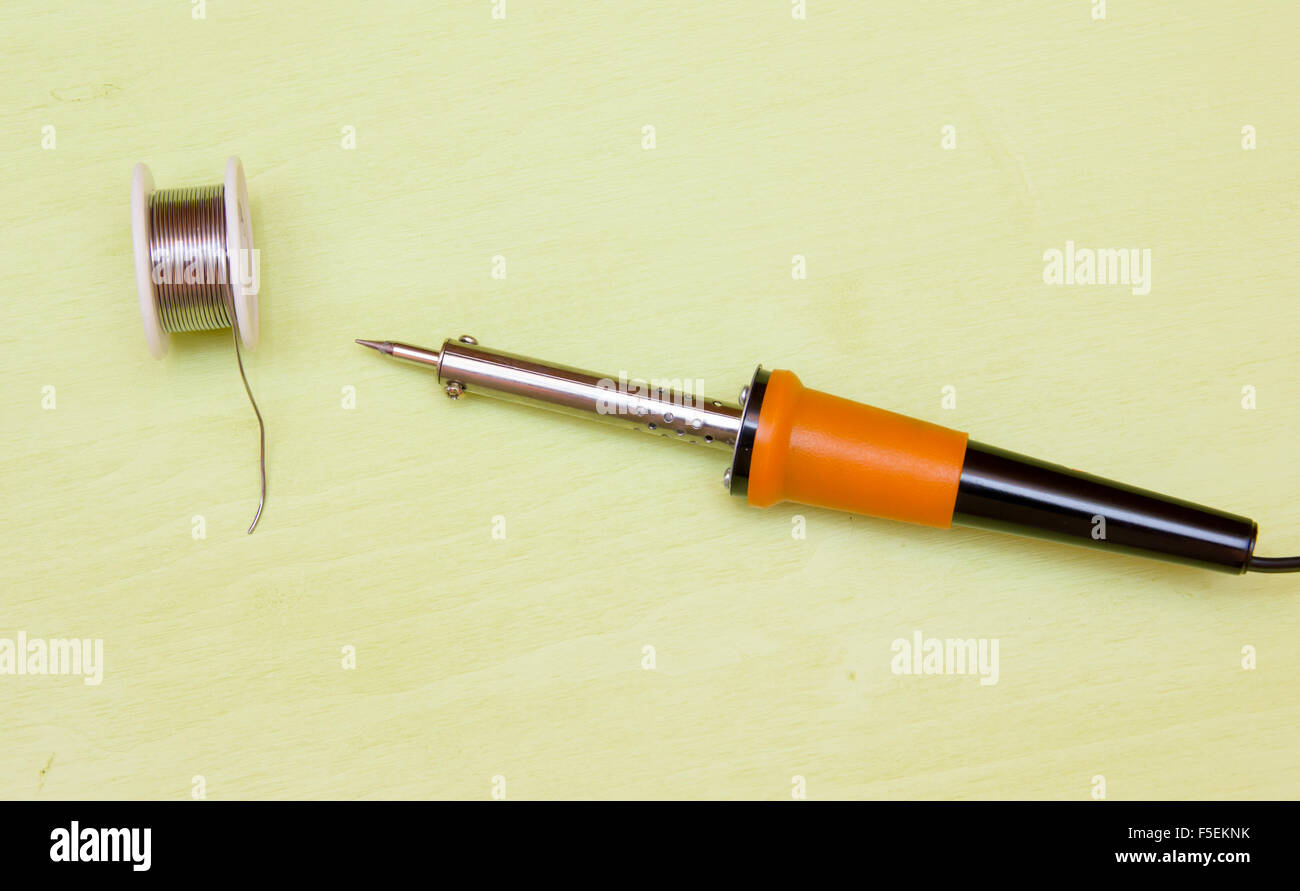 Soldering iron on the green table seen from above Stock Photo - Alamy