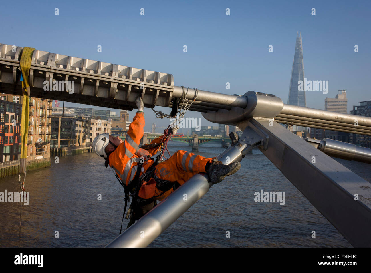 With the Shard in the background, a cleaning crew with the contractor ...