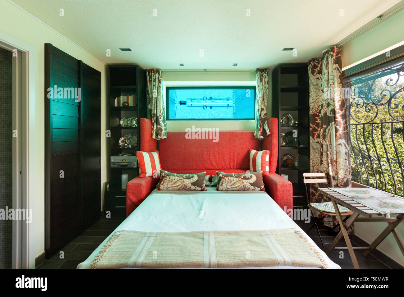 guest room of an house, double bed with pool window Stock Photo - Alamy