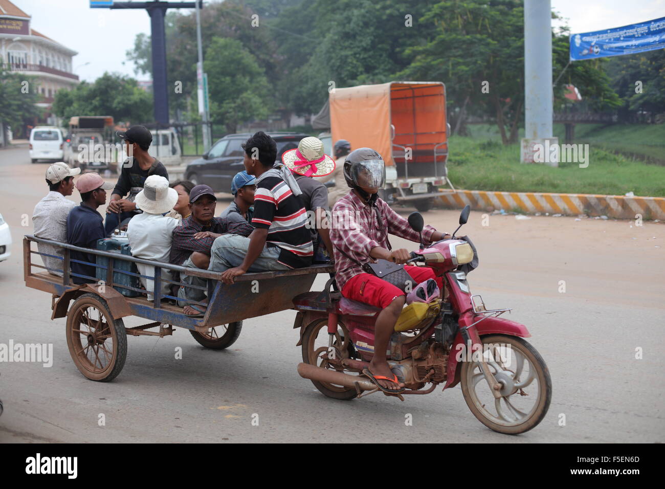 Group of people on motorbike trailer Stock Photo - Alamy