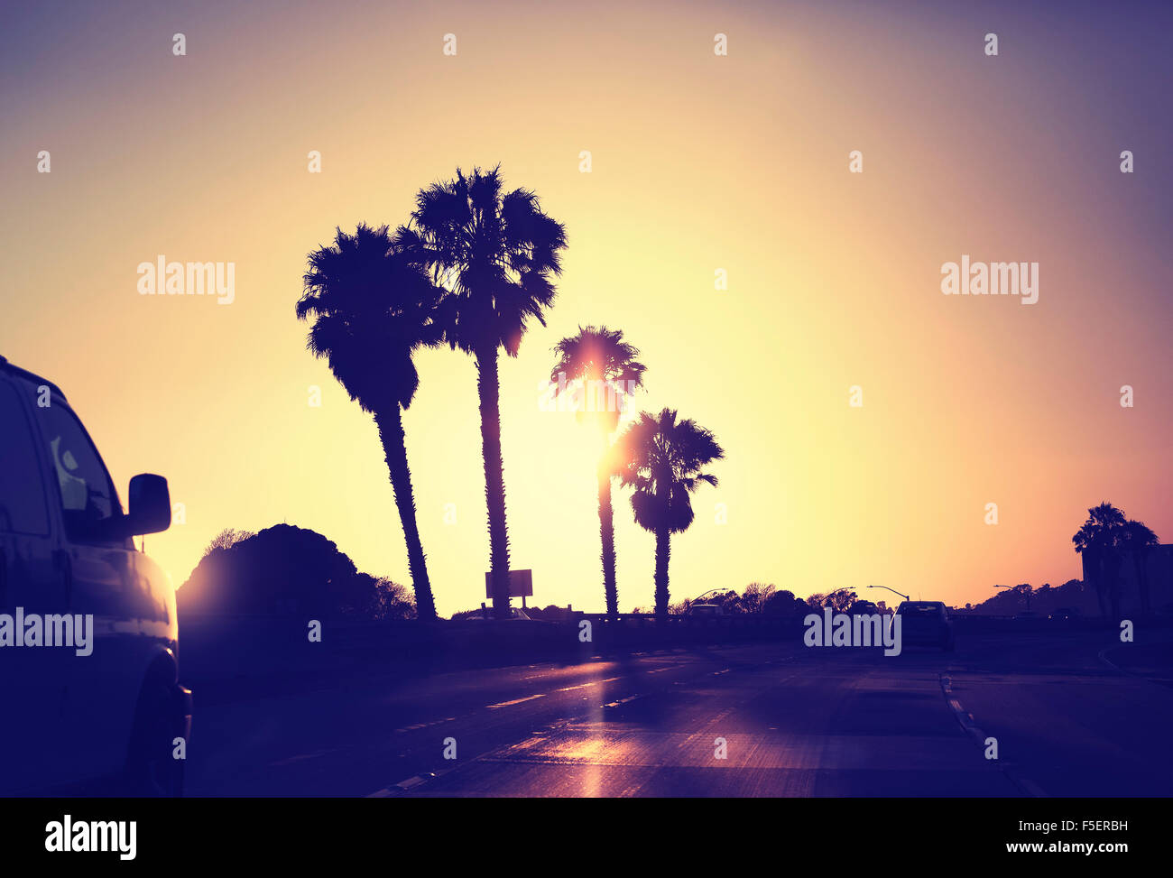 Vintage stylized picture of road against sunset, California, USA Stock ...