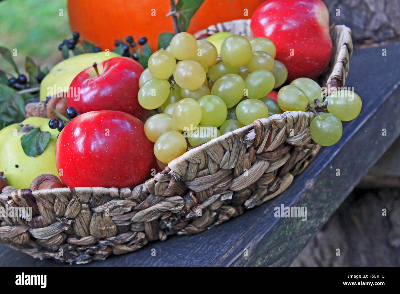 Rustic still life with harvest fruits with vintage basket on old wood ...