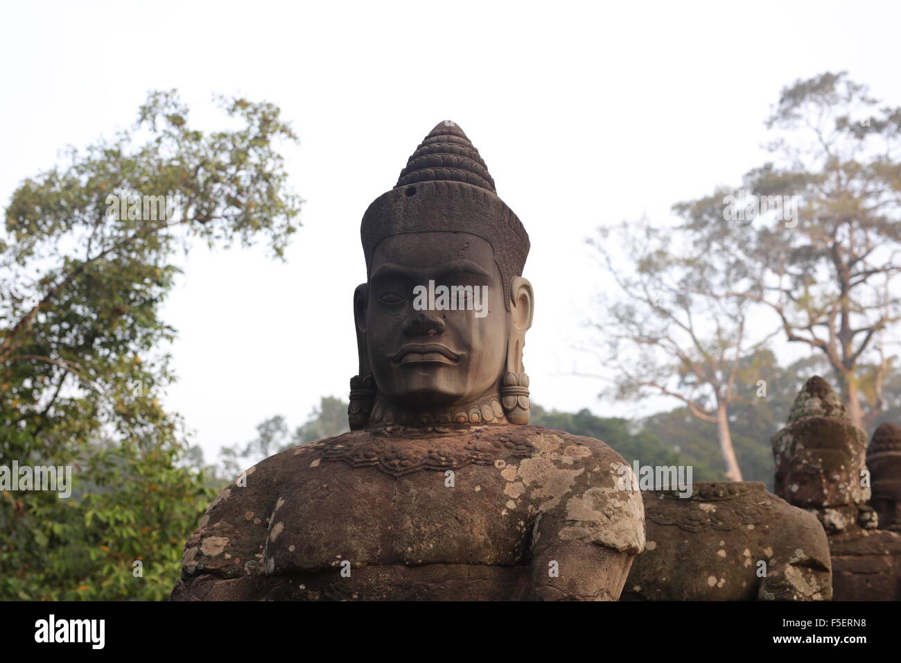 Portraits of stone statues in Angkor Wat Stock Photo - Alamy