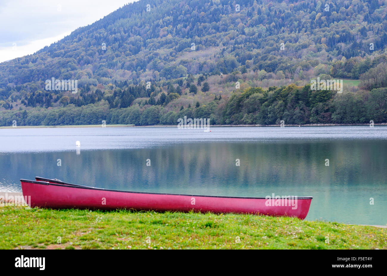 Two red canoes on the Grand lac de Laffrey is one of the Laffrey lakes ...