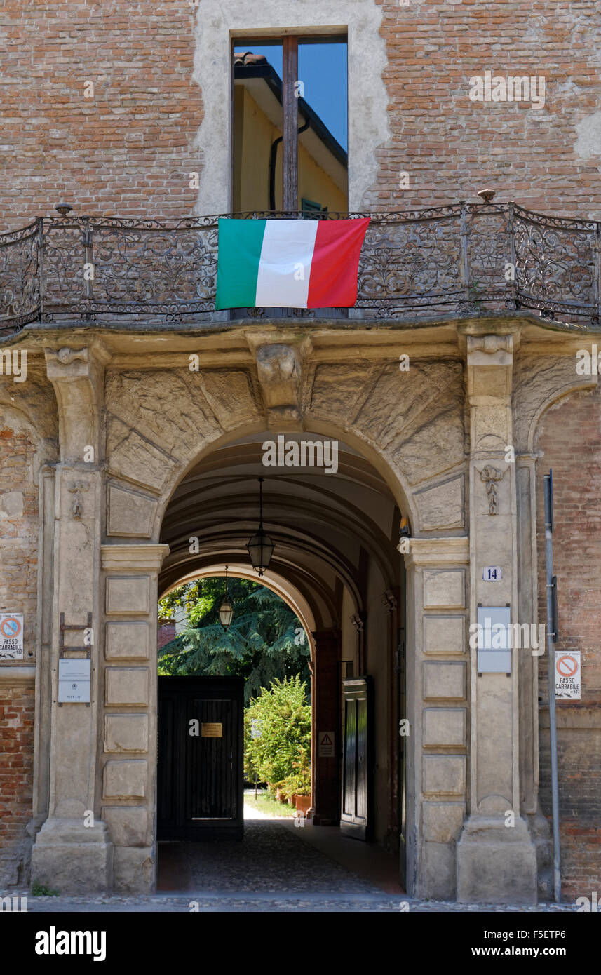 Old palace with the Italian flag hanging from a balcony, Faenza, Italy ...