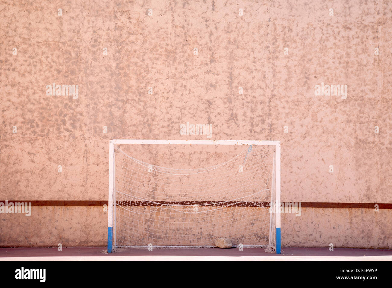 Football Goal with Stone Wall Behind Stock Photo - Alamy