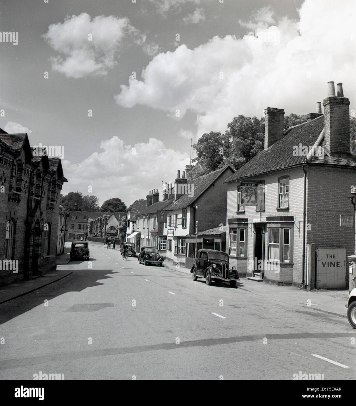 1950s, historical, high street, showing a pub, The Vine, England, UK ...