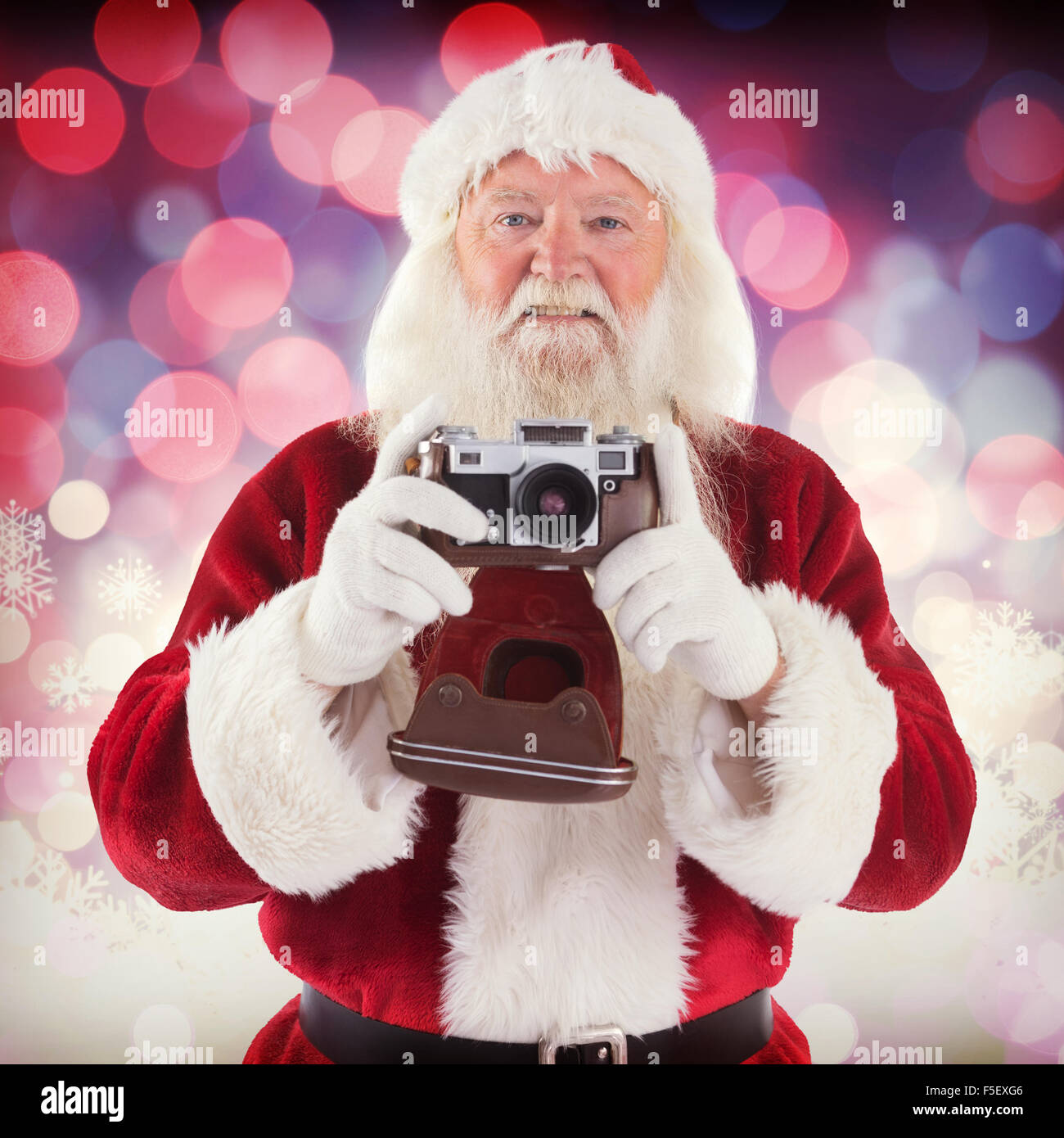 Composite image of santa is taking a picture Stock Photo - Alamy