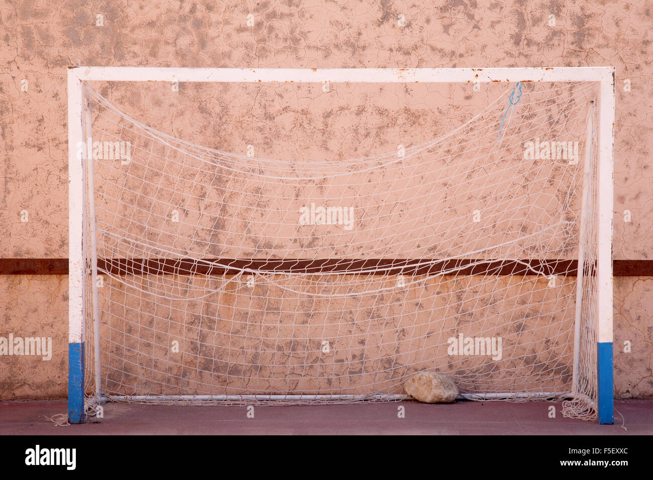 Football Goal with Stone Wall Behind Stock Photo - Alamy