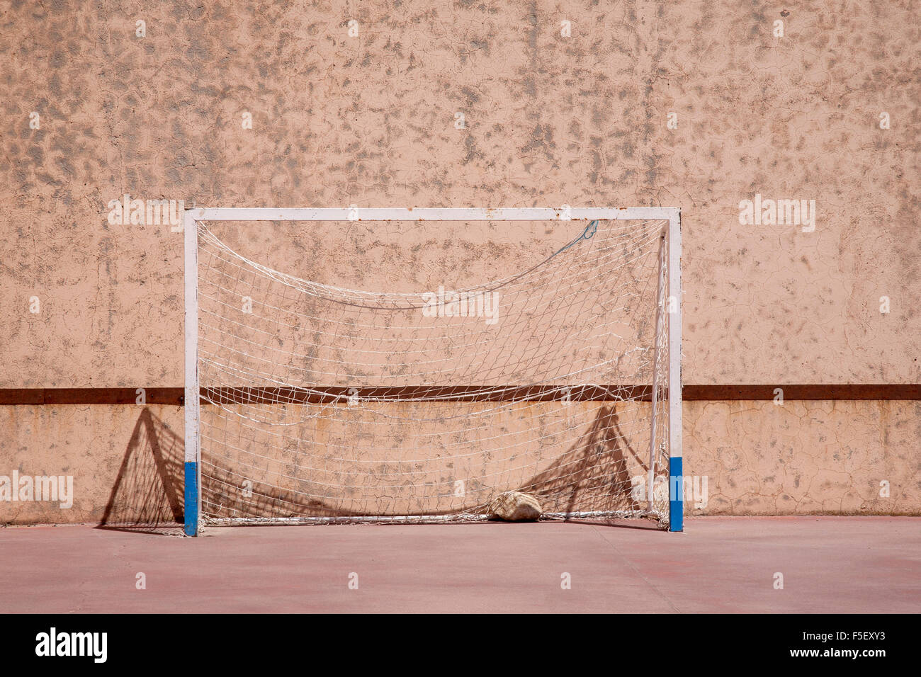 Football Goal with Stone Wall Behind Stock Photo - Alamy
