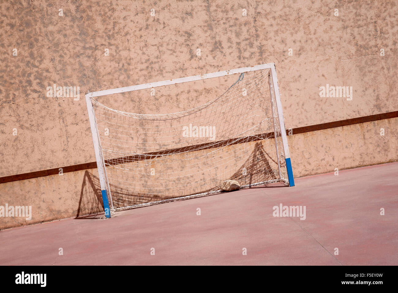 Football Goal with Stone Wall Behind Stock Photo - Alamy