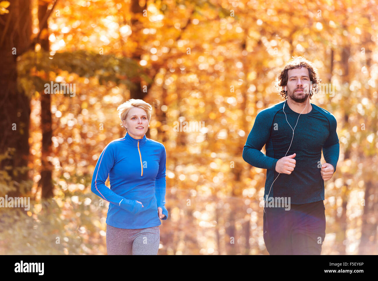 Beautiful couple running Stock Photo - Alamy