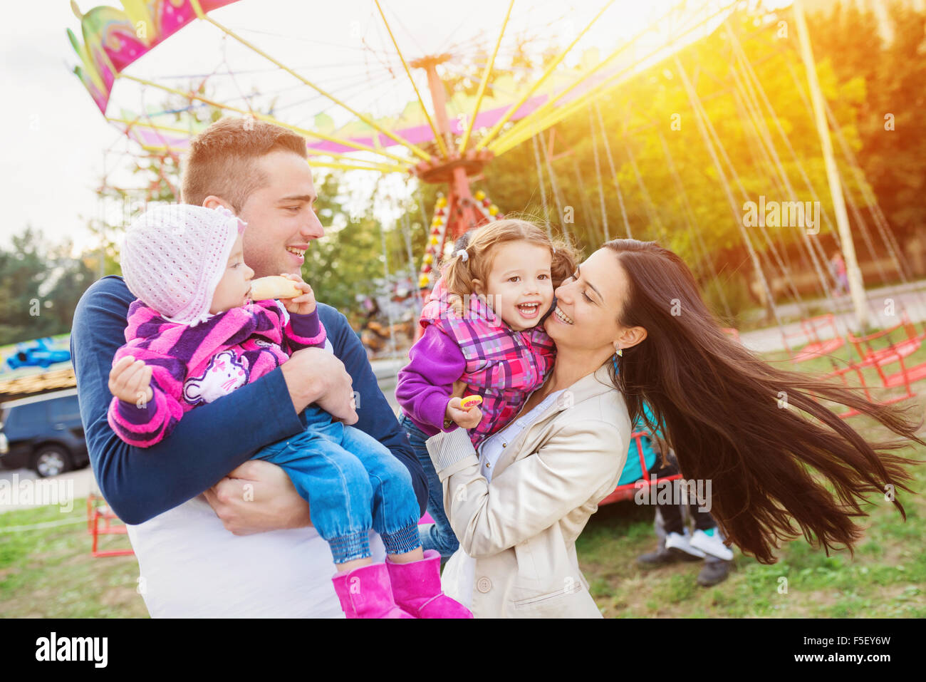 Family at fun fair Stock Photo - Alamy
