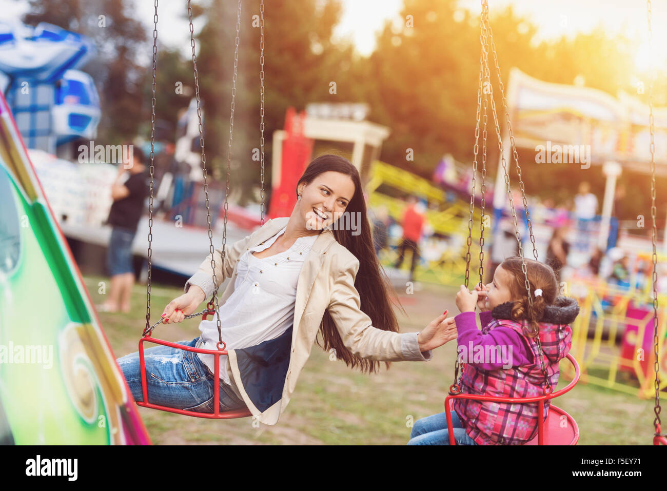 Mother and daughter at fun fair Stock Photo - Alamy