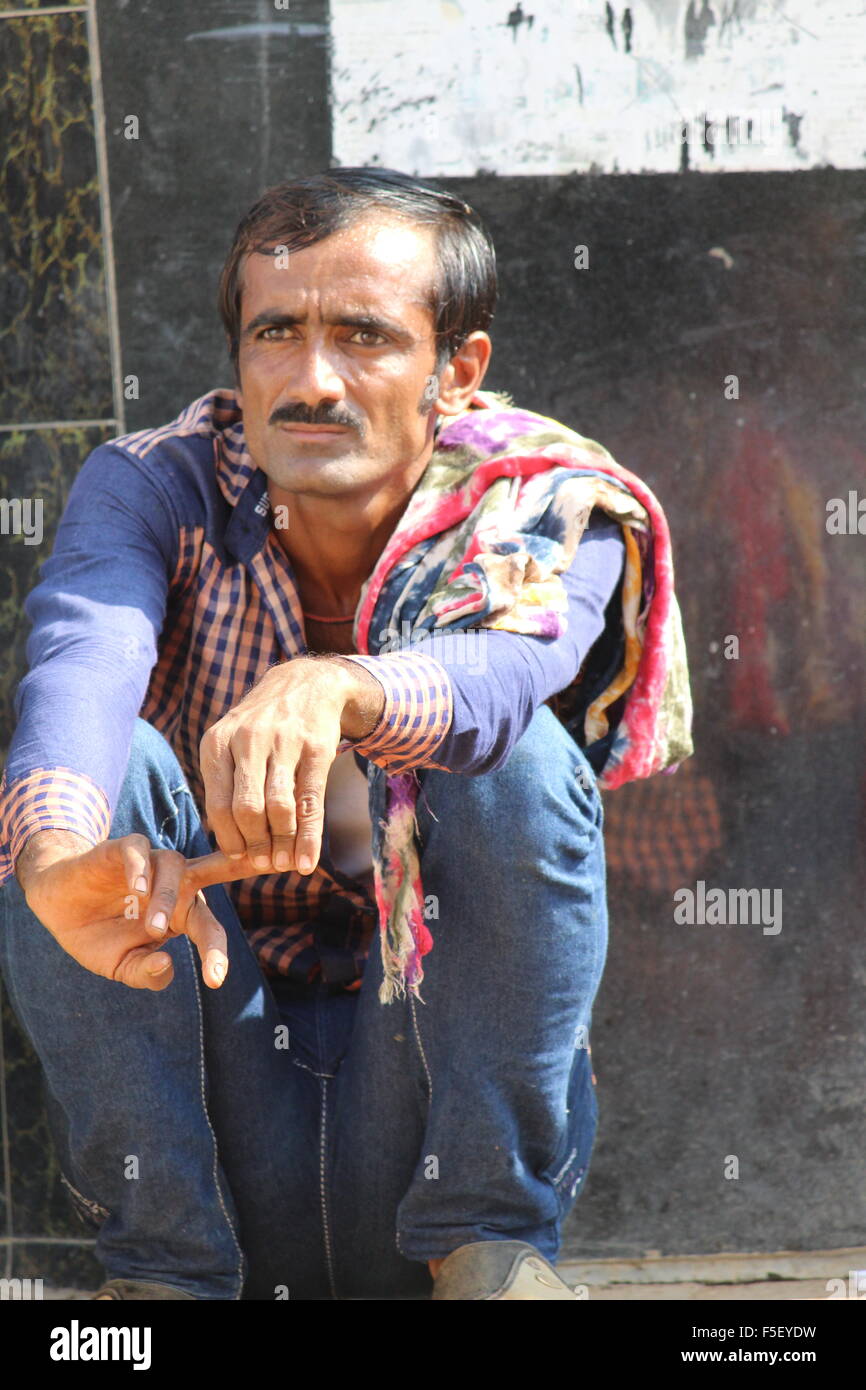 Natural rustic man siting in his daily routine style Stock Photo - Alamy