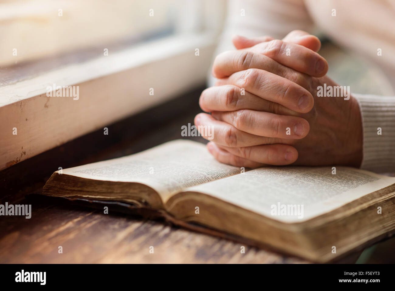 Woman with bible Stock Photo - Alamy