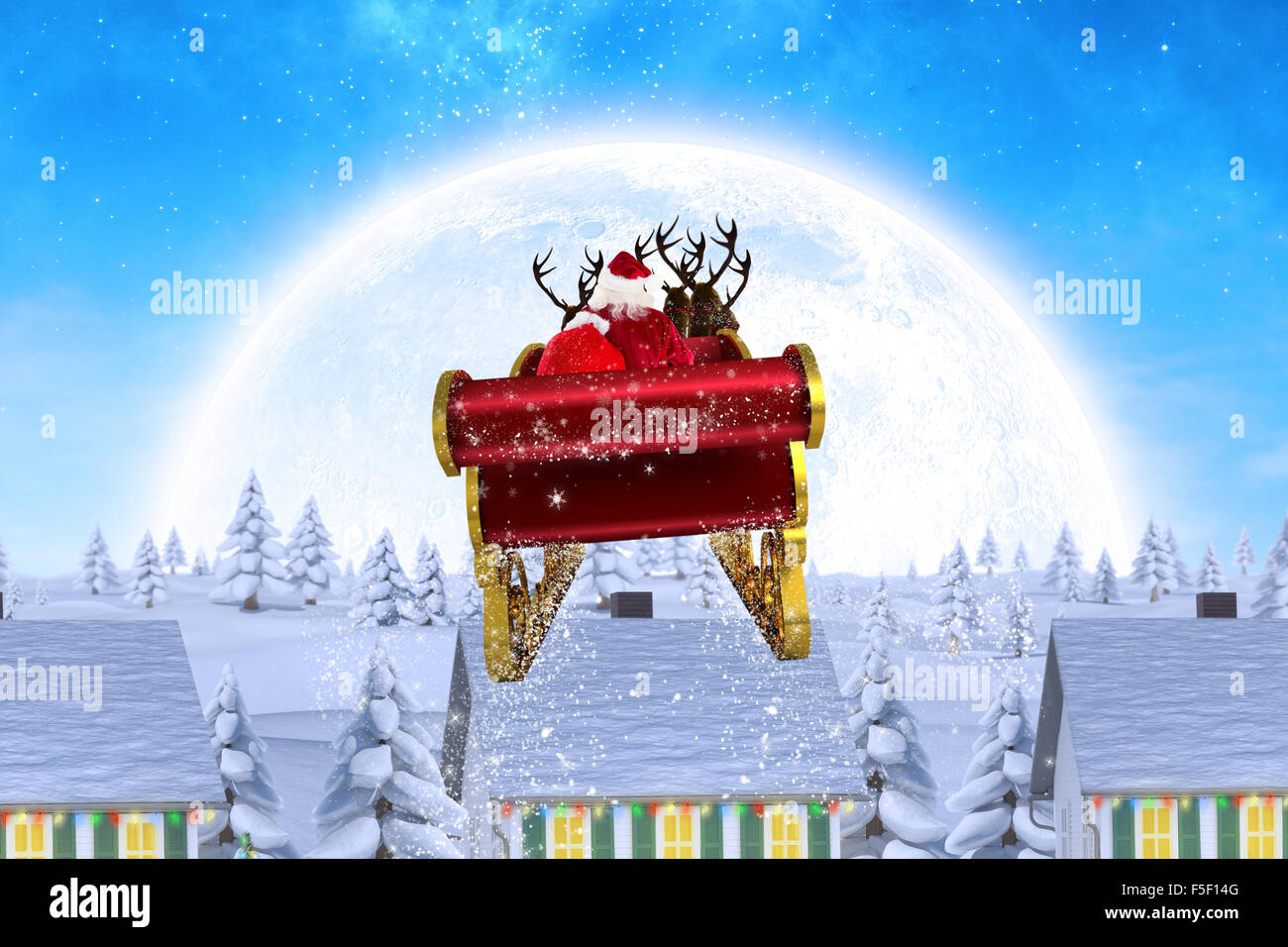 Composite image of santa flying his sleigh Stock Photo - Alamy