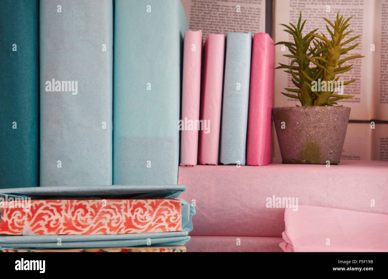 Covered uneven books as decoration in soft color tones Stock Photo - Alamy
